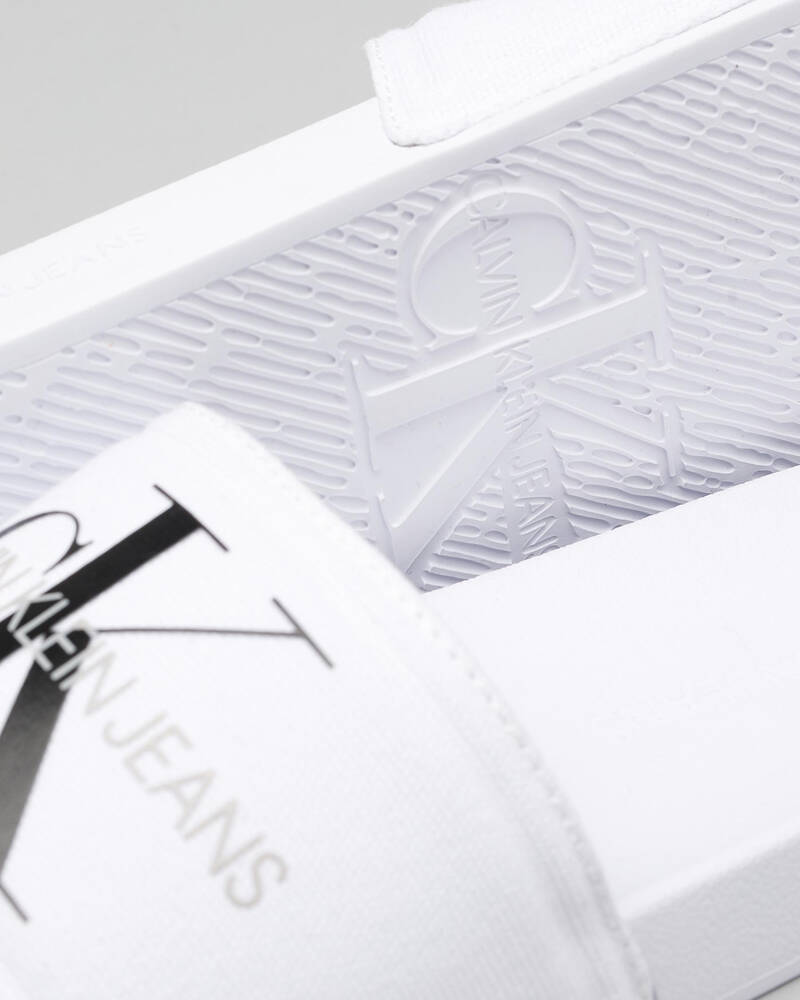 Shop Calvin Klein Monogram Slide Sandals In Bright White - Fast ...