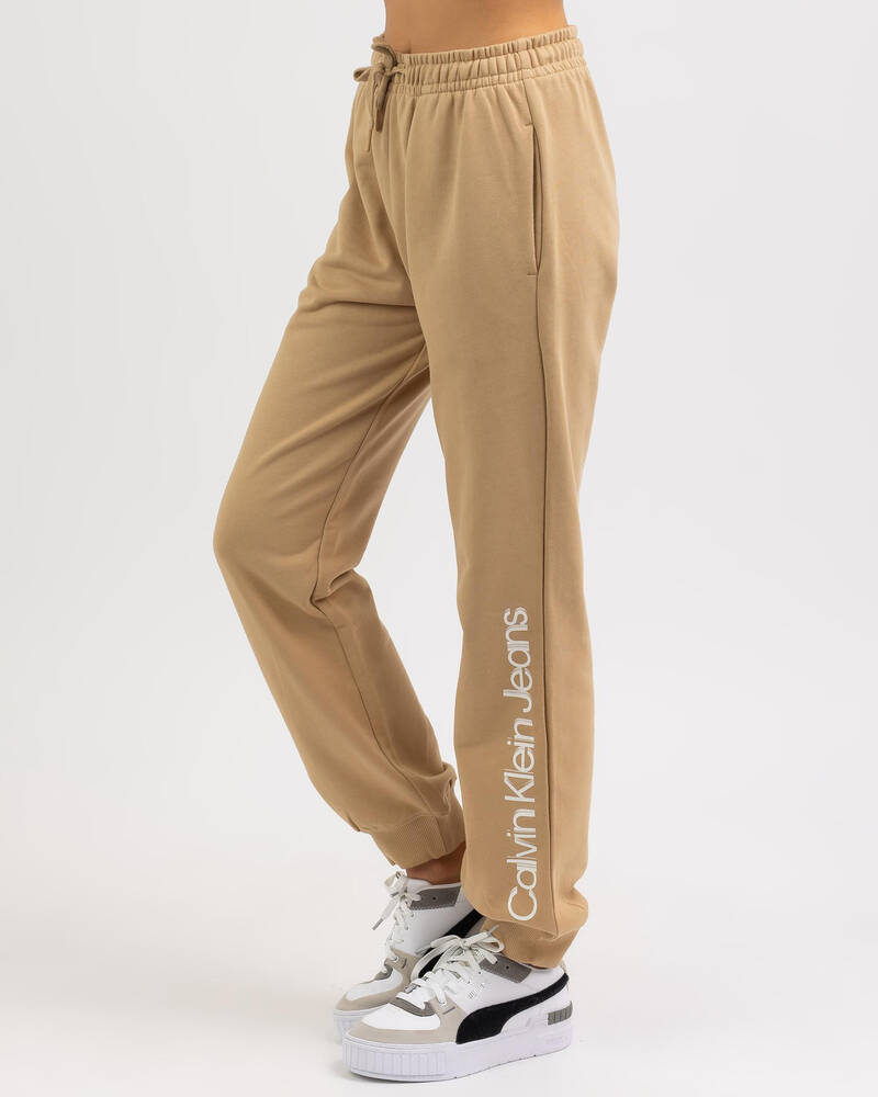 Shop Calvin Klein Faded Logo Track Pants In Tawny Sand - Fast Shipping ...