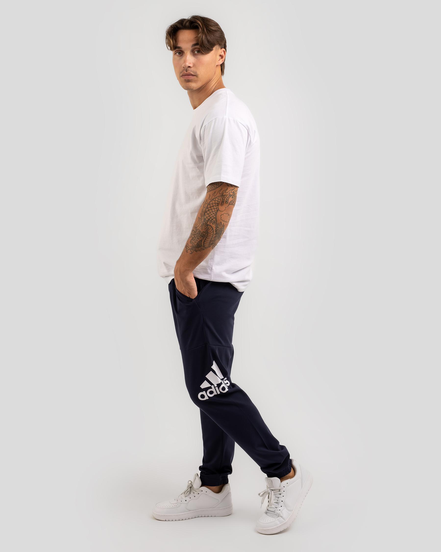 Shop adidas Essential Logo Track Pants In Legend Ink - Fast Shipping ...