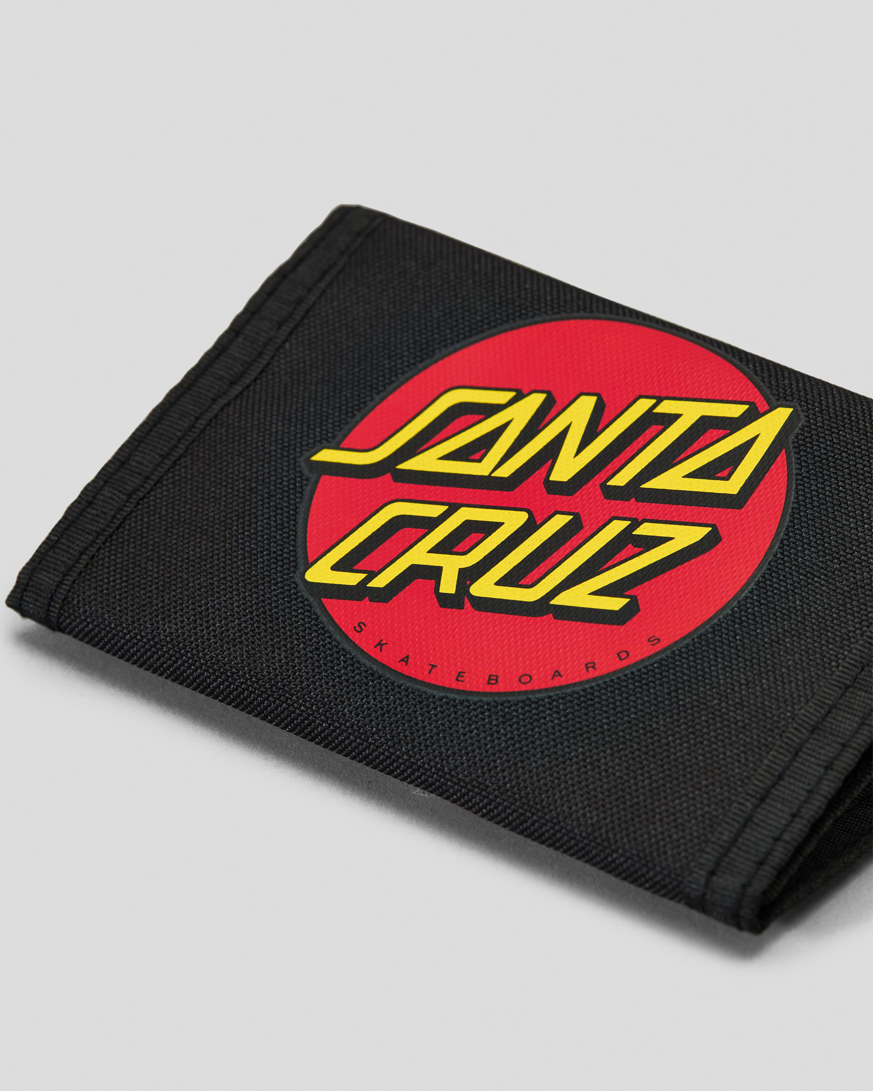 Shop Santa Cruz Classic Dot Trifold Wallet In Black - Fast Shipping ...