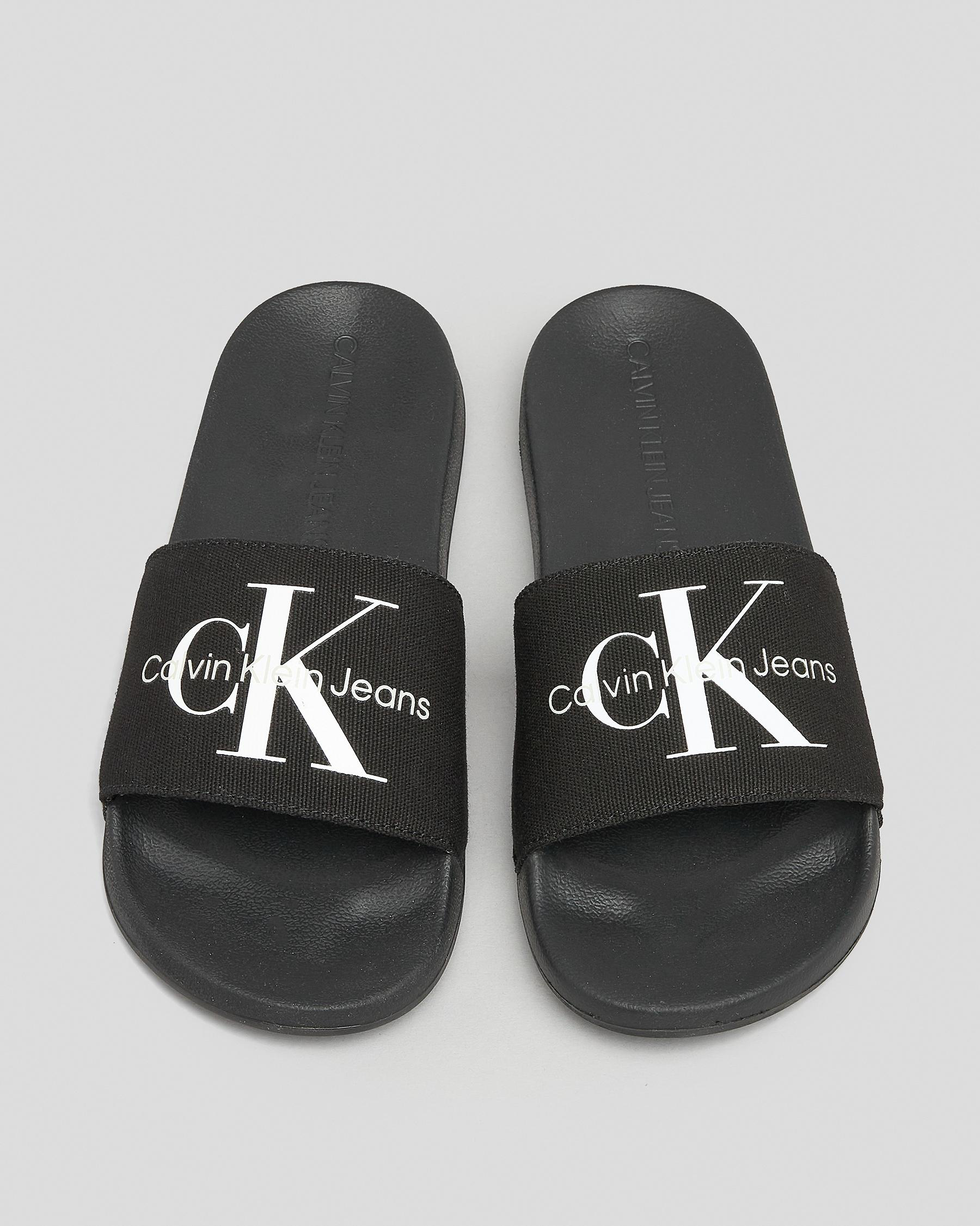 Shop Calvin Klein Slide Monogram CO In Black - Fast Shipping & Easy ...