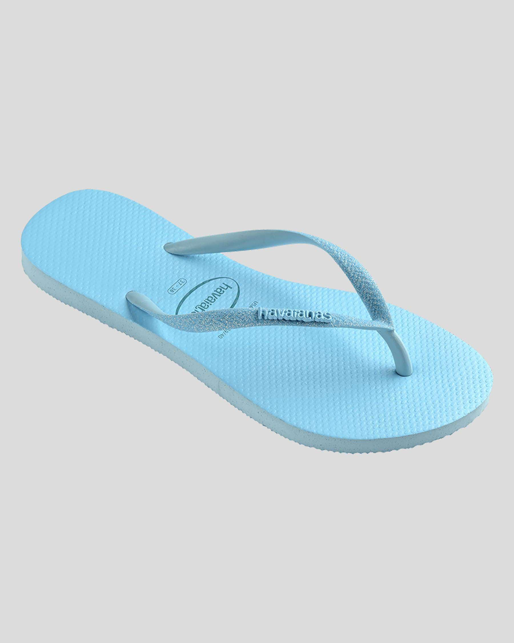 Shop Havaianas Slim Glitter Iridescent Thongs In Lavender Blue - Fast ...
