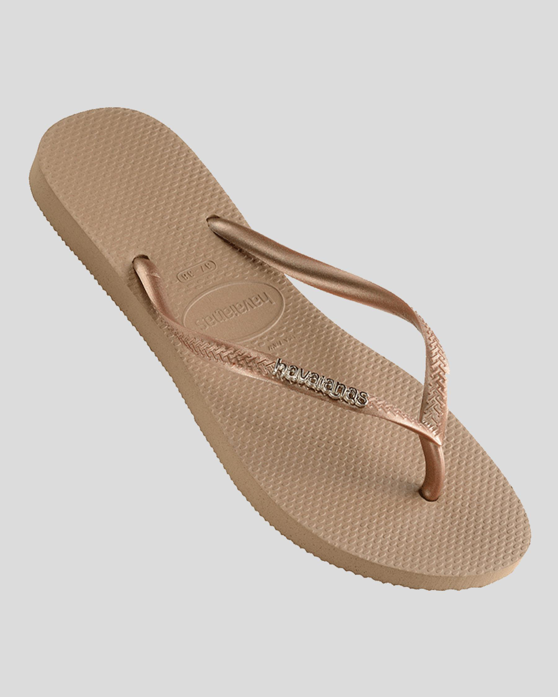 Shop Havaianas Slim Metal Logo Thongs In Rose Gold/rose Gold Silver ...