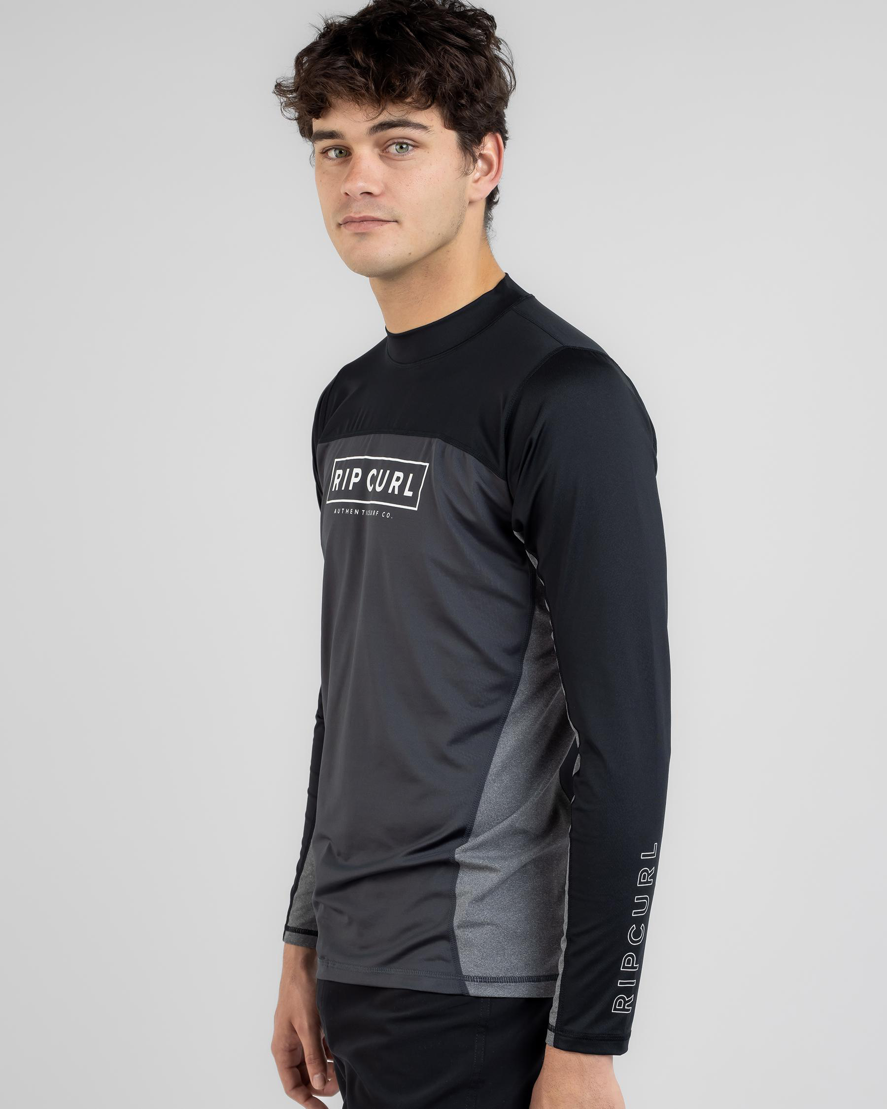 Shop Rip Curl Drive Long Sleeve Rash Vest In Black - Fast Shipping ...