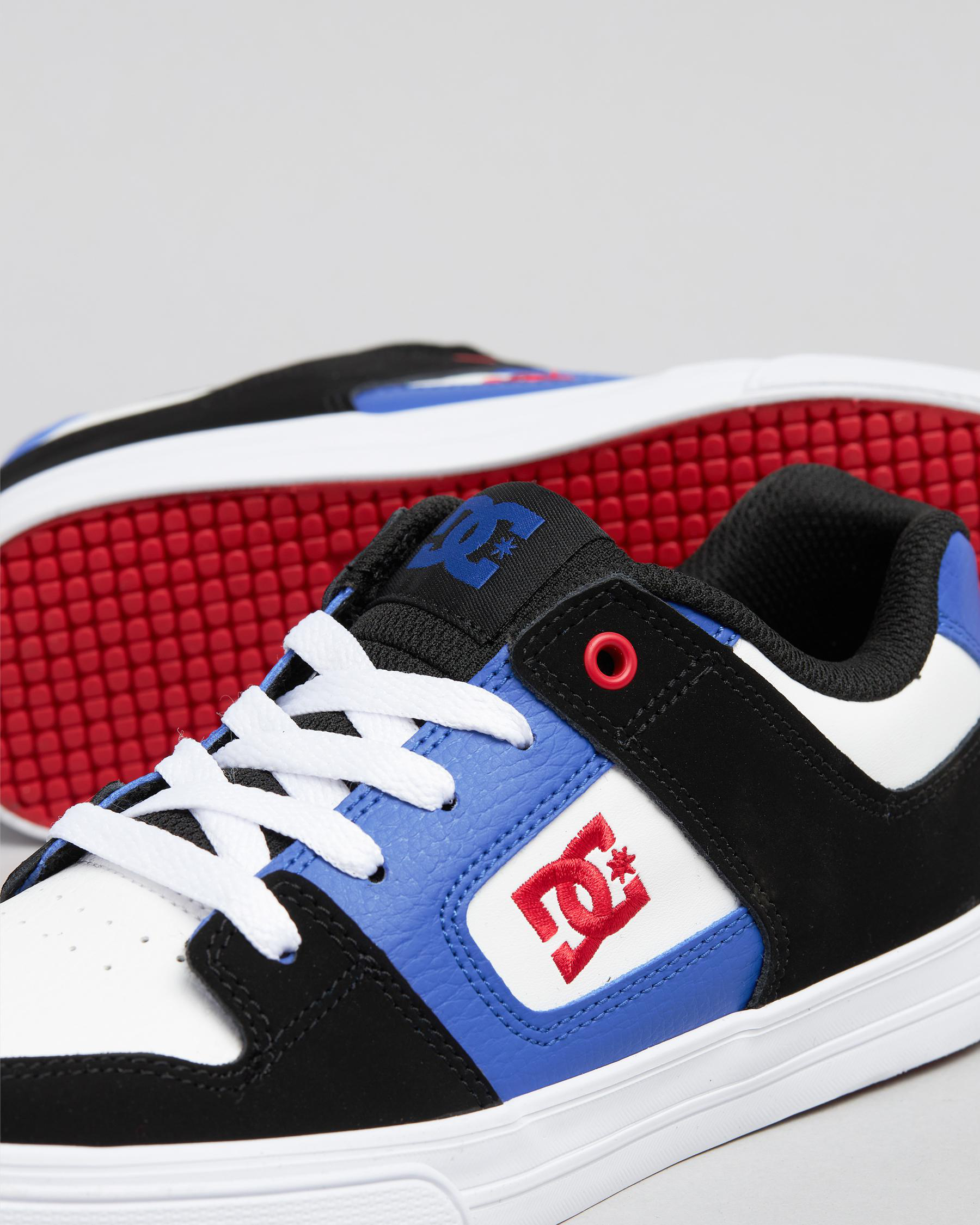 Shop DC Shoes Boys' Pure Shoes In Black/royal/athletic Red - Fast ...